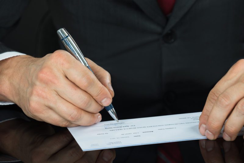 How To Cash a Check | How Do I Cash a Check? | Fiscal Tiger